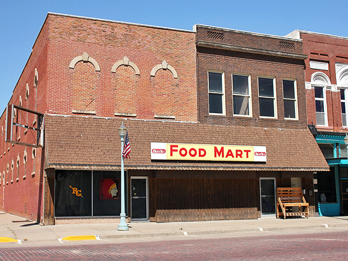 The Food Mart's no-nonsense facade tells you exactly what you're getting: straightforward provisions without the frills, just like Red Cloud itself. 