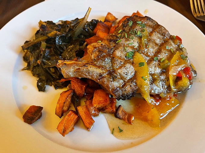 This pork chop has been treated with the respect it deserves&mdash;perfectly grilled alongside collards and sweet potatoes that make vegetables feel like an indulgence.