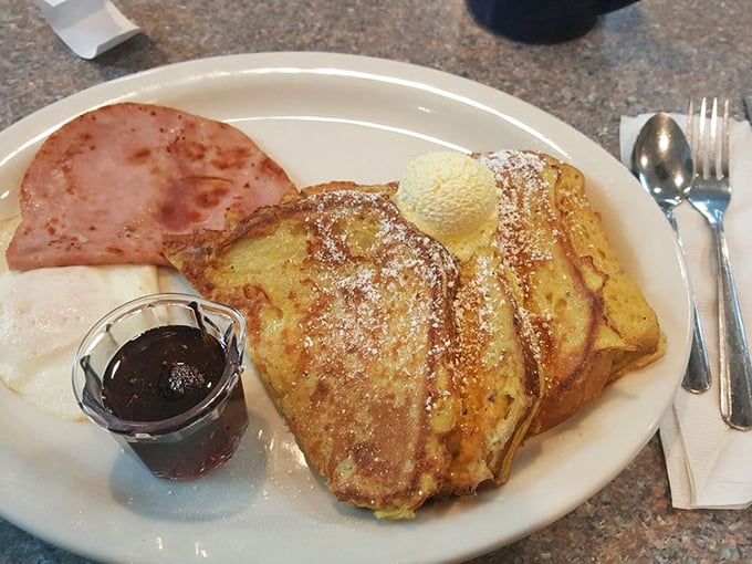 French toast that's achieved that mythical balance &ndash; crisp edges, custardy center, and just enough powdered sugar to make you feel like you're getting away with something.