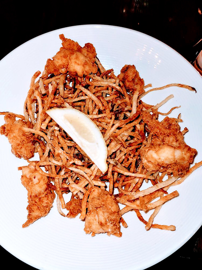 Crispy, golden fried lobster bites nestled among shoestring potatoes&mdash;the ocean and the earth finding delicious common ground.