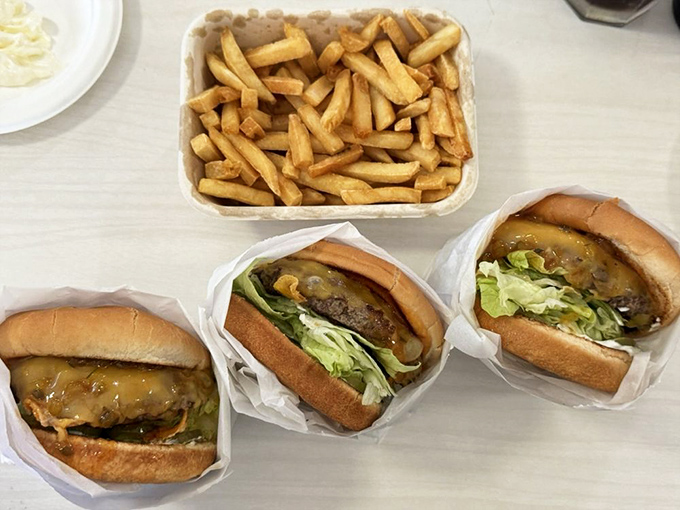 Fries served in a paper boat, ready to sail across the sea of ketchup you're about to create. Simple, golden, perfect.