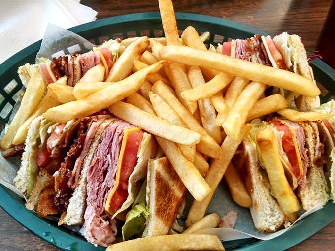The club sandwich&mdash;architecture you can eat. Skyscraper of meat, supported by toothpick columns, surrounded by a golden french fry foundation.