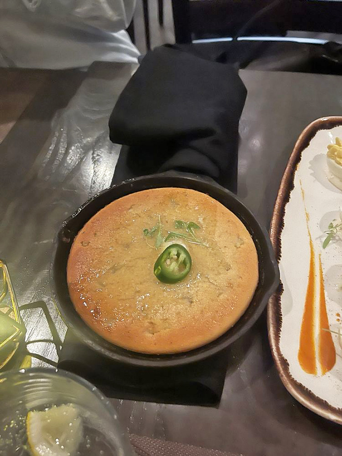 Cornbread with attitude &ndash; that jalape&ntilde;o on top isn't just decoration, it's a promise of the perfect spicy-sweet balance waiting inside.