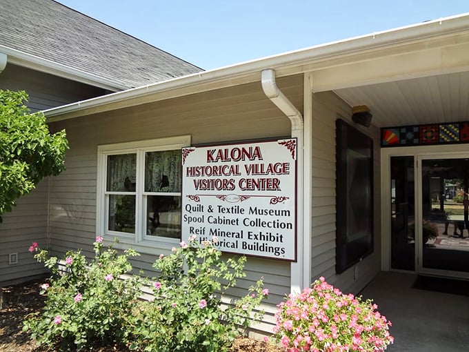 The Kalona Historical Village Visitors Center welcomes curious travelers with promises of quilts, artifacts, and stories from a simpler time.