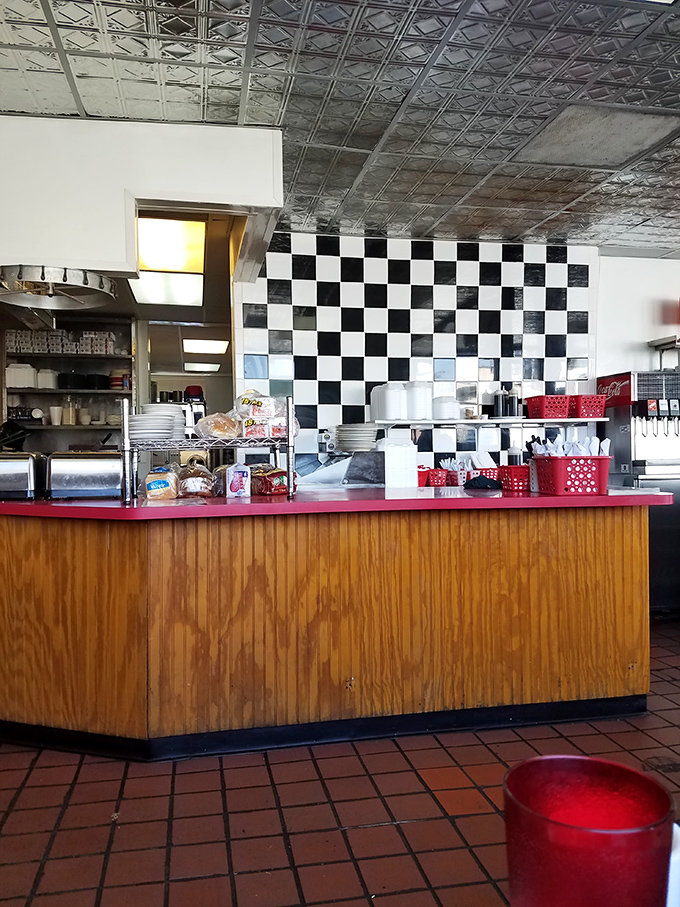 Behind that classic black and white checkered wall, breakfast magic happens. The kitchen—where ordinary ingredients become extraordinary memories.