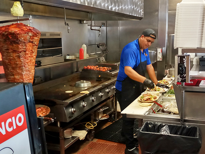 Where the magic happens &ndash; a glimpse into the kitchen reveals the careful assembly of each taco, a delicious choreography of skilled hands.
