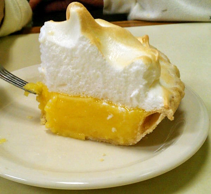 Lemon meringue pie with peaks so high they need their own elevation warning&mdash;sunshine on a plate.
