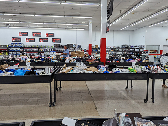 Tables piled with possibilities. What looks like chaos to the uninitiated is actually an organized system of progressive discounts and surprising finds.