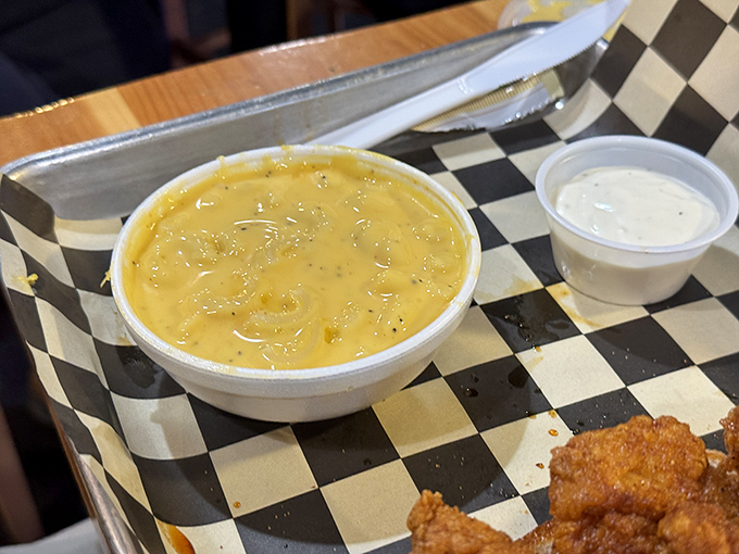 That mac and cheese isn't just a side&mdash;it's edible fire insurance, standing by to rescue your taste buds when they wave the white flag.