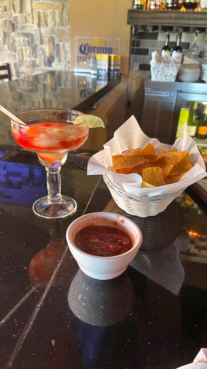 A margarita rimmed with spicy chamoy alongside fresh chips and salsa&mdash;the holy trinity of Mexican restaurant starters.