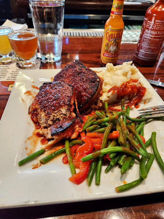 Meatloaf that would make your grandmother both jealous and proud, paired with mashed potatoes that clearly never came from a box.