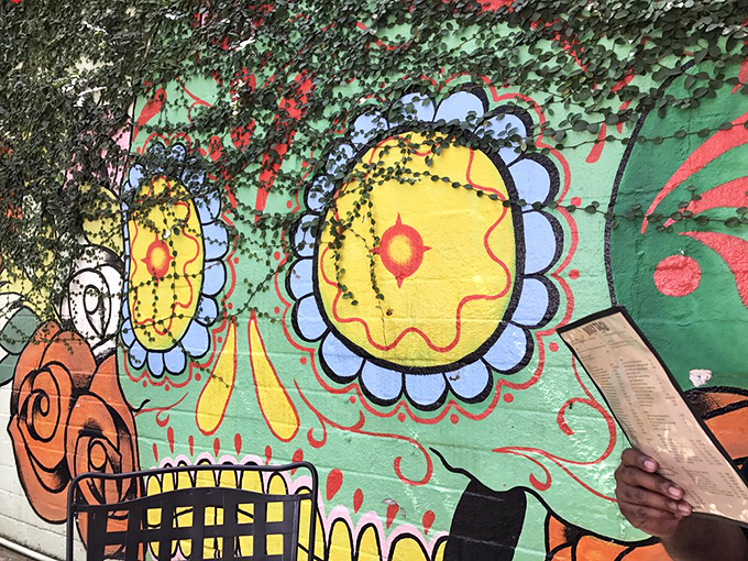 The vibrant exterior mural art tells you exactly what you're in for&mdash;a colorful explosion of flavors that doesn't take itself too seriously.