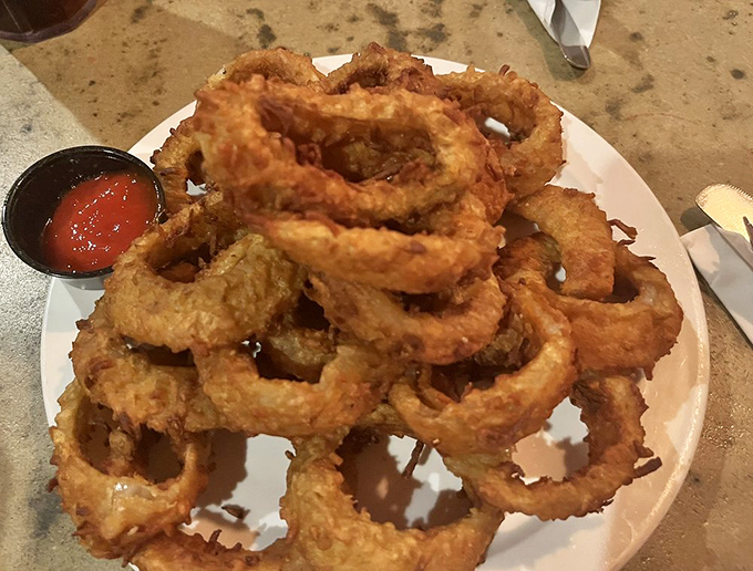 Onion rings with the perfect crunch-to-softness ratio—the kind that make you temporarily forget that vegetables are supposed to be healthy.