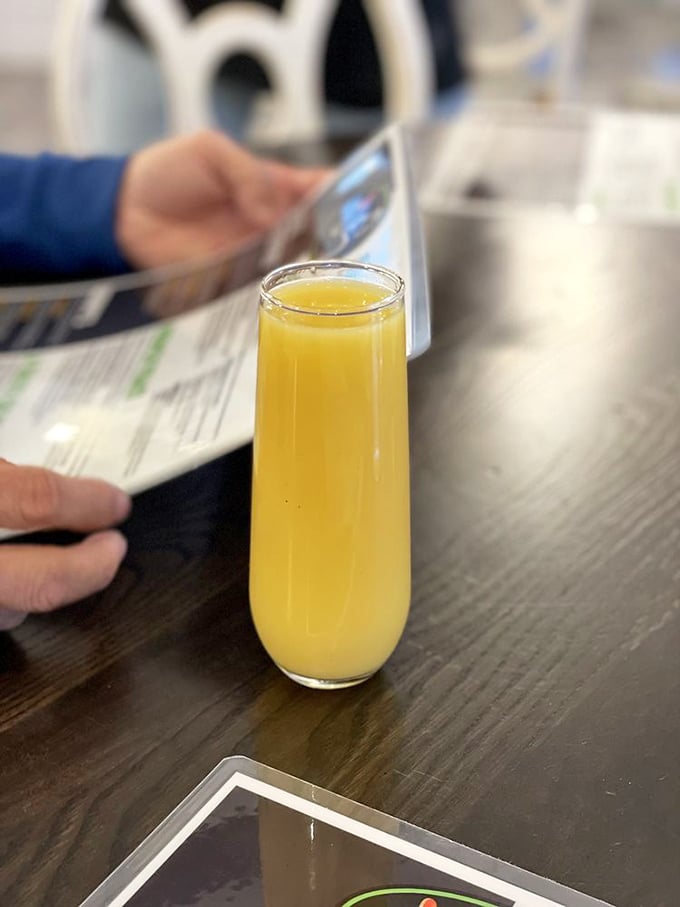 Fresh orange juice in a tall, slender glass &ndash; liquid sunshine to wash down whatever breakfast masterpiece awaits your fork.