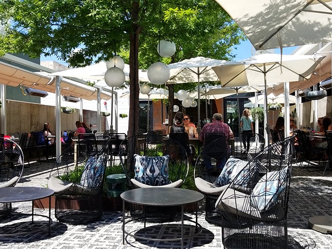 Outdoor dining under white umbrellas isn't just an option&mdash;it's practically mandatory when Oklahoma City's weather plays nice.