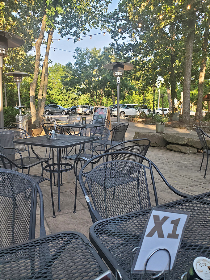 Dappled sunlight through oak trees makes Fred's outdoor patio the perfect spot for enjoying smoky delights in nature's dining room.