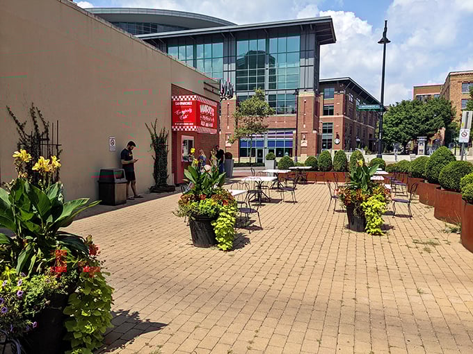 The outdoor patio, where strangers become friends united by the universal experience of trying to eat a cheesesteak without wearing half of it.