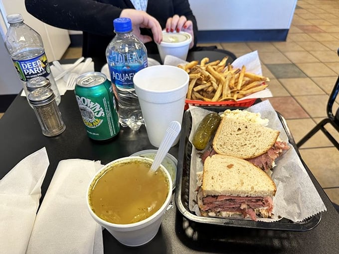The complete deli experience: hearty soup, towering sandwich, crisp pickle, and golden fries. Just add a nap for the perfect afternoon.