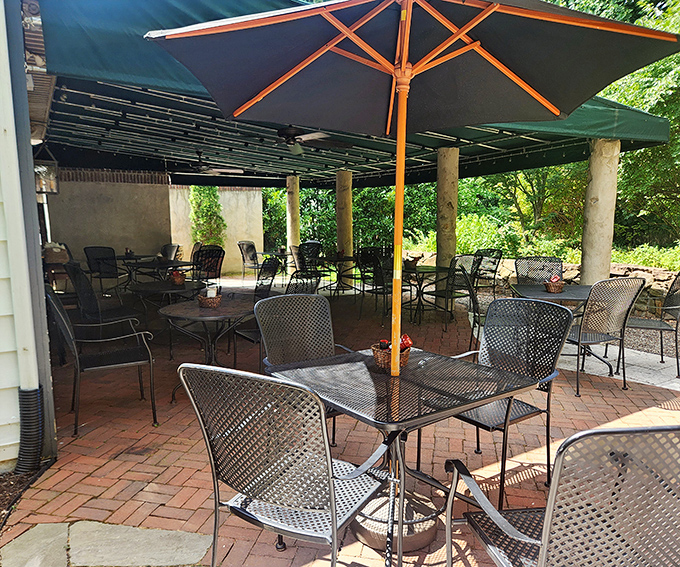 The outdoor patio offers nature's dining room&mdash;brick underfoot, greenery overhead, and enough fresh air to make everything taste just a little bit better.