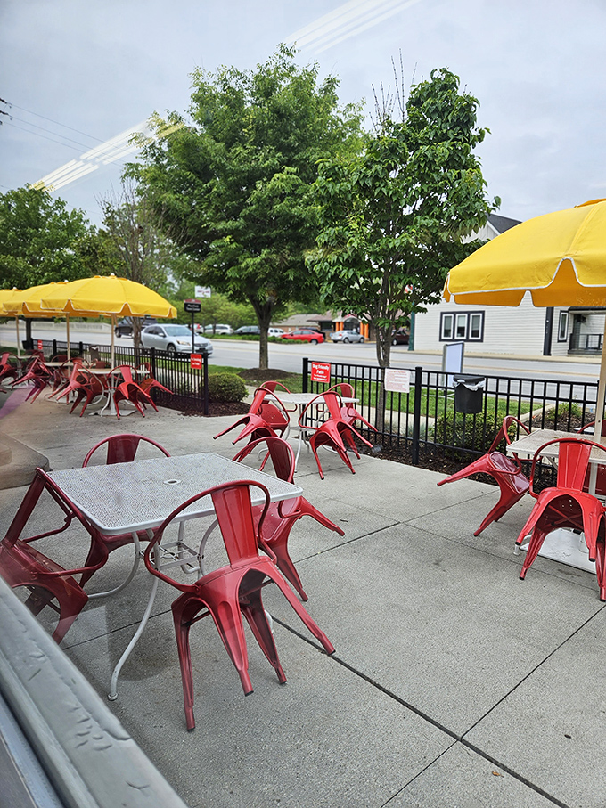 The outdoor patio with cheerful red chairs offers fresh air dining with a side of people-watching&mdash;summer in Indiana never looked so appetizing.