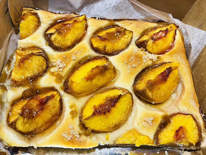 The legendary Baltimore peach cake – where fresh fruit meets sweet dough in a marriage so perfect it should have its own reality show.