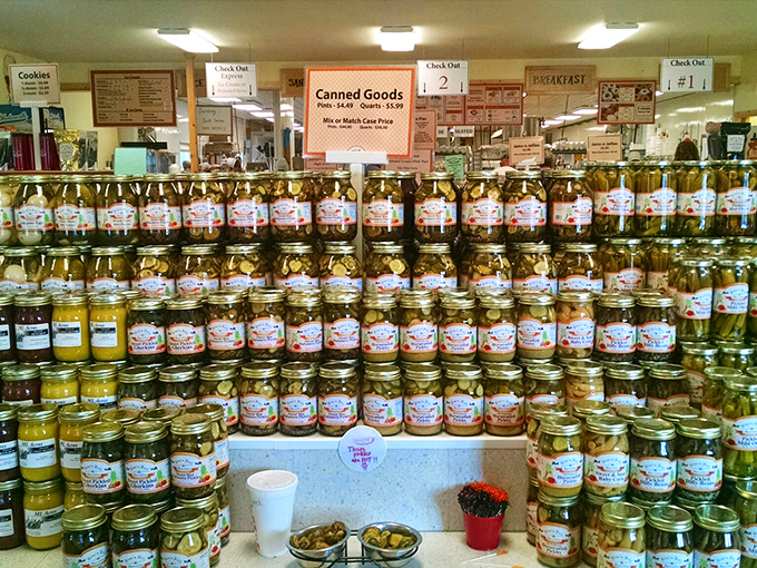 Gleaming jars stand in formation like sweet soldiers, each containing preserved treasures that promise to elevate any humble piece of toast.