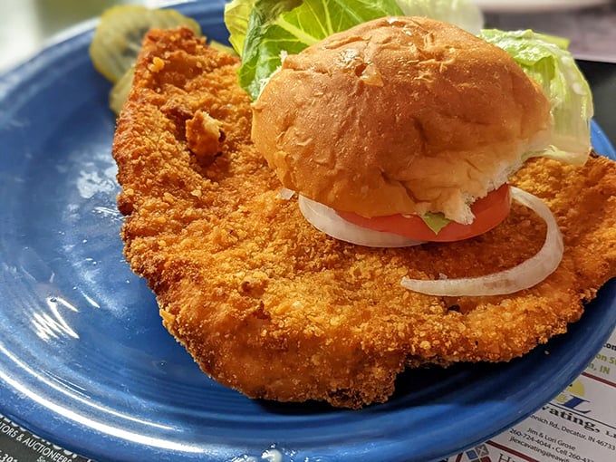 The famous tenderloin sandwich: where the pork is pounded so thin and fried so wide that finding the bun becomes a delicious treasure hunt.