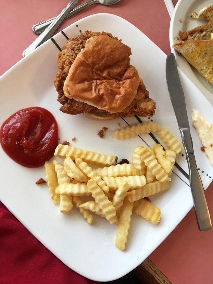 The quintessential Indiana pork tenderloin sandwich&mdash;a crispy-breaded miracle nestled in a bun that's clearly insufficient for its glorious dimensions, as tradition demands.