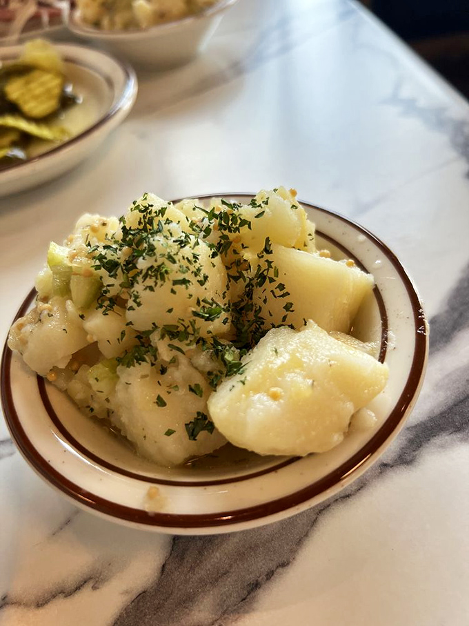 Potato salad that actually tastes like potatoes! With fresh herbs sprinkled on top like confetti at a spud celebration.