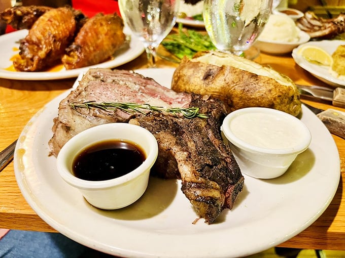 Prime rib presented with reverence alongside a baked potato&mdash;a plate that whispers "special occasion" while shouting "America!" with every bite.