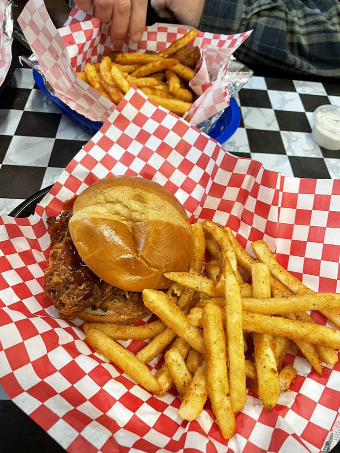 This pulled pork sandwich isn't just food; it's a commitment&mdash;to napkins, to flavor, to the understanding that some stains on your shirt are badges of honor.