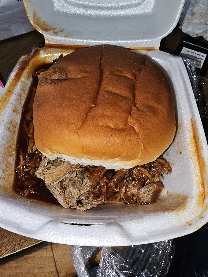 This pulled pork sandwich isn't just food&mdash;it's a commitment. The bun exists merely as a vessel for delivering maximum meat-to-mouth efficiency.