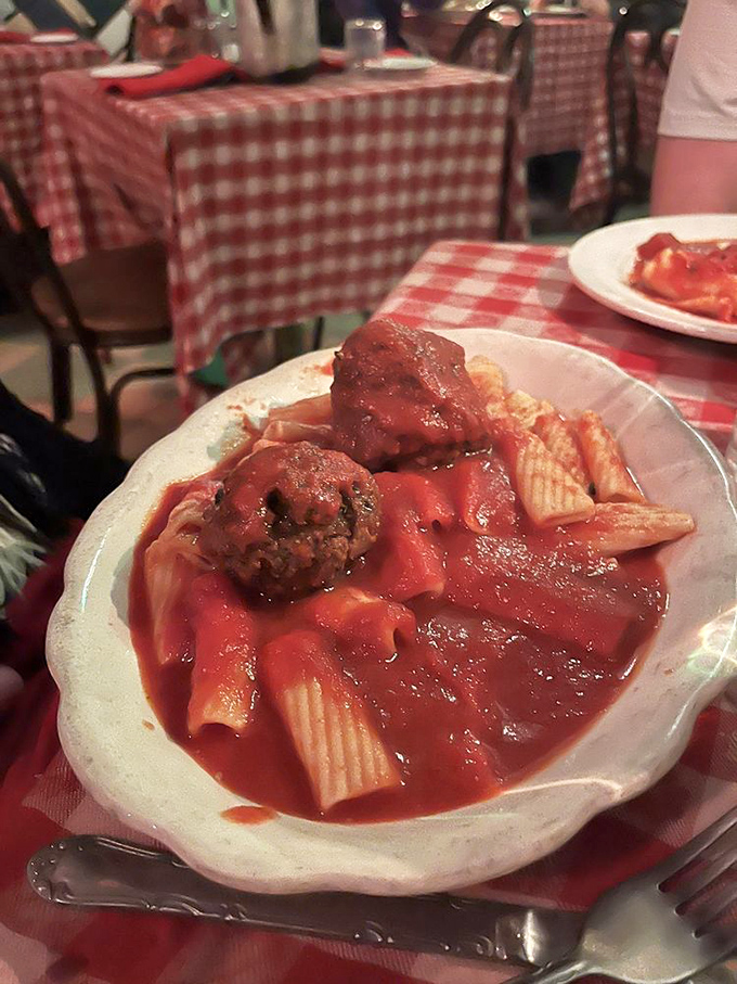 Rigatoni tubes perfectly engineered to capture maximum sauce. Those meatballs aren't just sitting there&mdash;they're holding court.