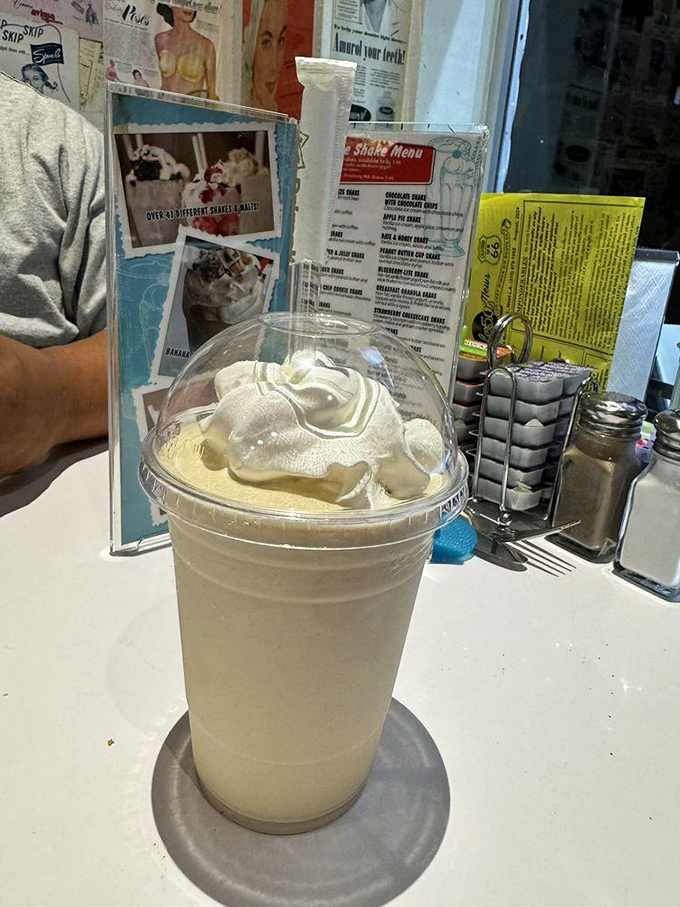 The milkshake that time forgot to stop making delicious. Thick enough to require serious straw commitment, topped with whipped cream architecture.