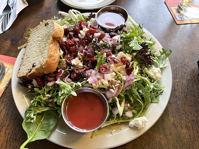 Even their salads tell a story&mdash;crisp greens sharing gossip with cranberries and cheese while two dressings stand by awaiting your decision.