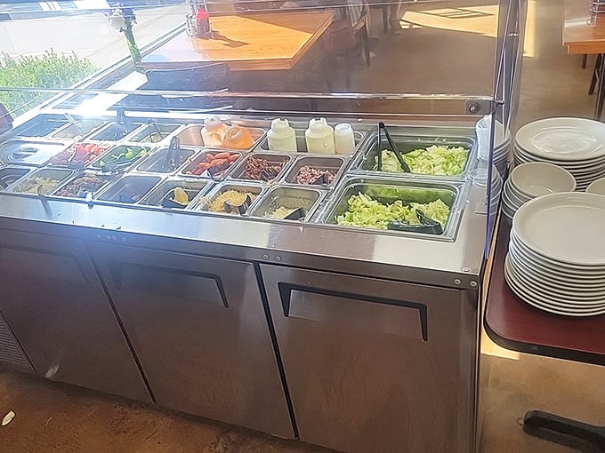 A salad bar that doesn't apologize for being straightforward&mdash;crisp vegetables waiting to complement whatever comfort food you've chosen.