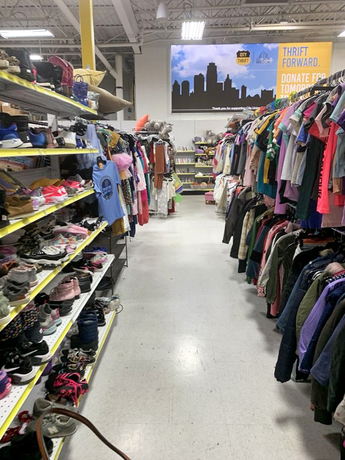 The Kansas City skyline watches over endless racks of potential outfits. Under those lights, someone's castoffs become someone else's signature style.