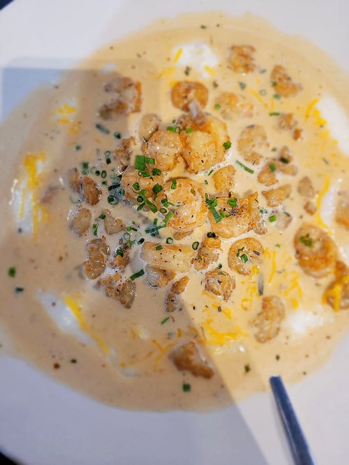 Shrimp and grits swimming in creamy, cheesy goodness &ndash; the kind of dish that makes you contemplate moving to Georgia permanently.