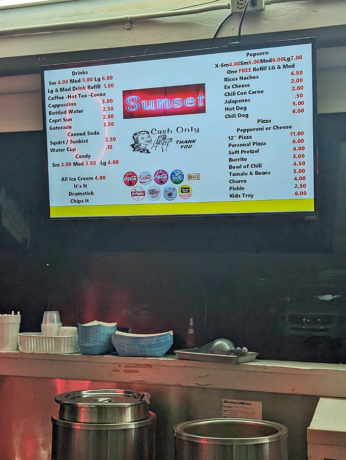 A menu board that reads like comfort food poetry, offering everything from classic popcorn to unexpected tamales and burritos.