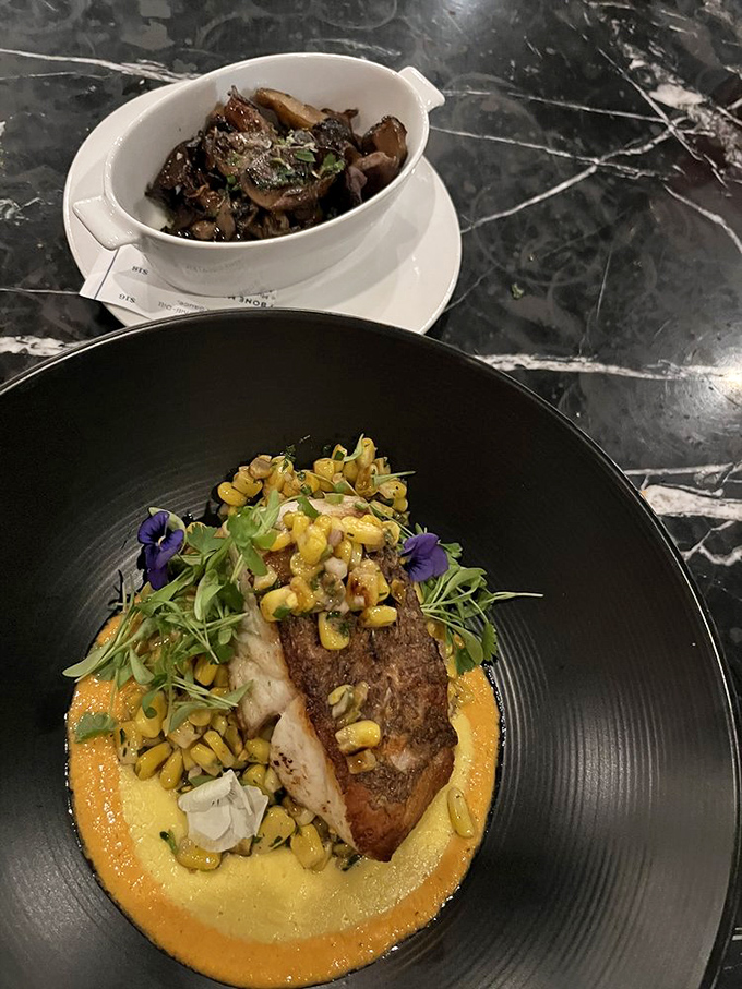 Fish that doesn't need to be "dressed up" to impress, resting on a vibrant corn pur&eacute;e that's summer sunshine translated into food.