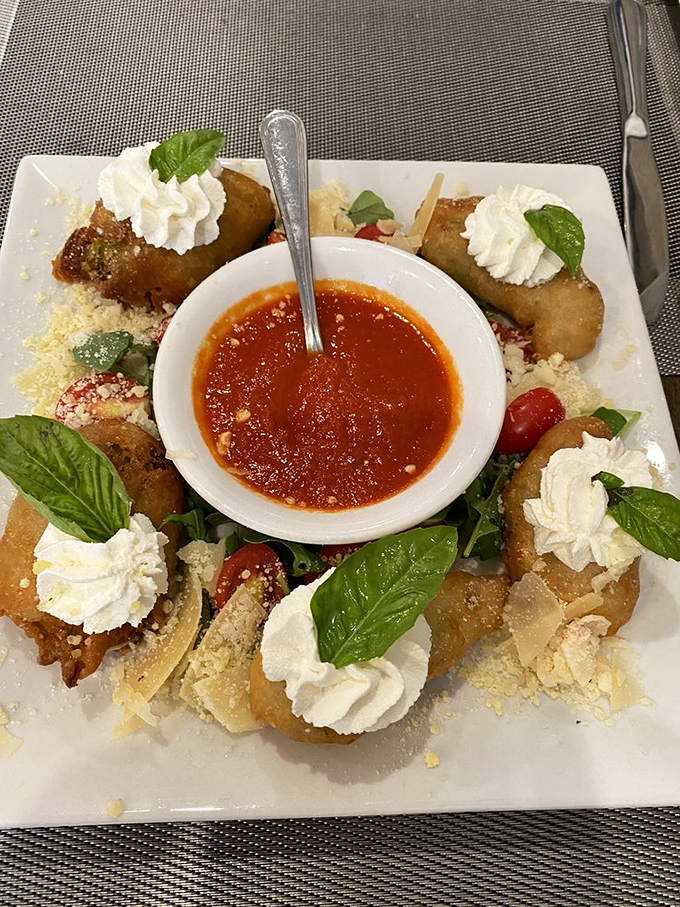 These aren't just appetizers&mdash;they're edible art. Crispy squash blossoms surrounding marinara like delicious satellites orbiting a tomato planet.