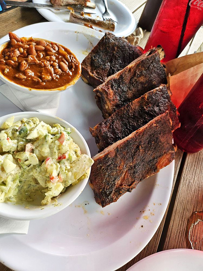 St. Louis ribs with potato salad and beans&mdash;the holy trinity of barbecue. That smoke ring is the halo these ribs deserve.