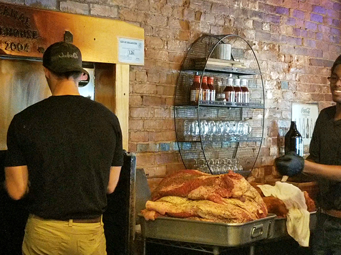 Behind the scenes, the staff prepares what looks like cornbread treasure—the unsung heroes ensuring your barbecue experience reaches mythical status.