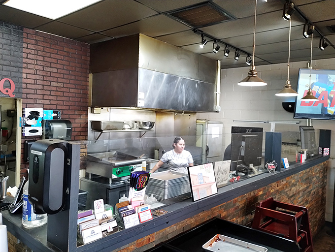 Where the magic happens &ndash; the pass between smoky creation and eager consumption. These folks are the unsung heroes of your food coma.