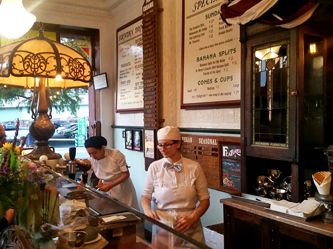 The soda jerks in crisp whites and bow ties aren't just servers&mdash;they're time-traveling artisans crafting edible joy one scoop at a time.