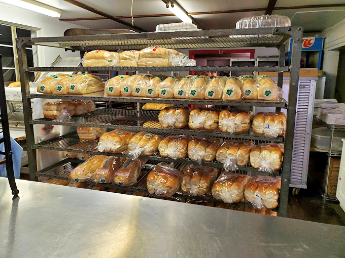 Bread heaven! Racks upon racks of freshly baked goods await their destiny. It's the bakery equivalent of a gold vault at Fort Knox.