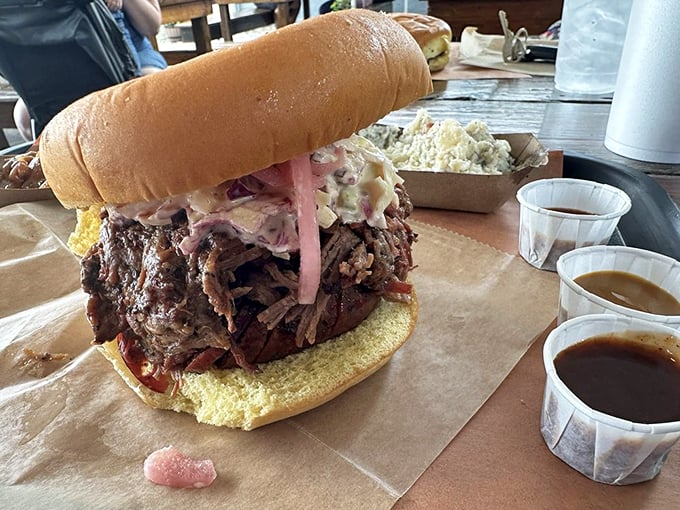 This sandwich isn't just tall&mdash;it's skyscraper-ambitious. The pink pickled onions cut through richness like a witty comeback at a dinner party.