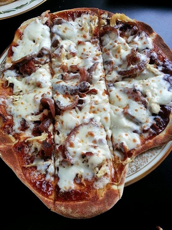 This pizza's generous toppings are having what can only be described as a delicious family reunion under a blanket of melted cheese.