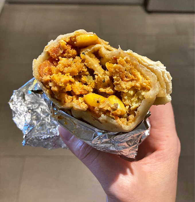 The cross-section reveals the careful layering that creates flavor harmony. Each component is distinct yet works in concert with its neighbors.