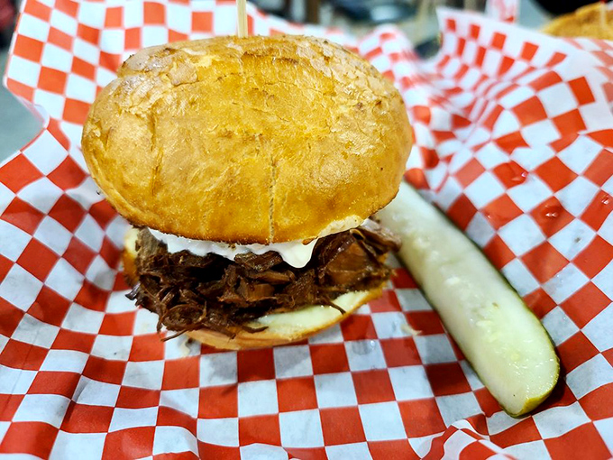 This isn't just a sandwich—it's a statement. The golden bun crowning slow-cooked meat tells you someone in that kitchen really cares.
